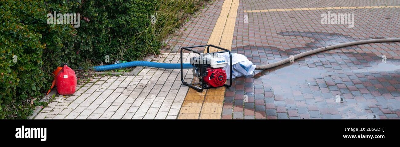 Gasoline operated Centrifugal engine-driven pump is pumping wastewater ...