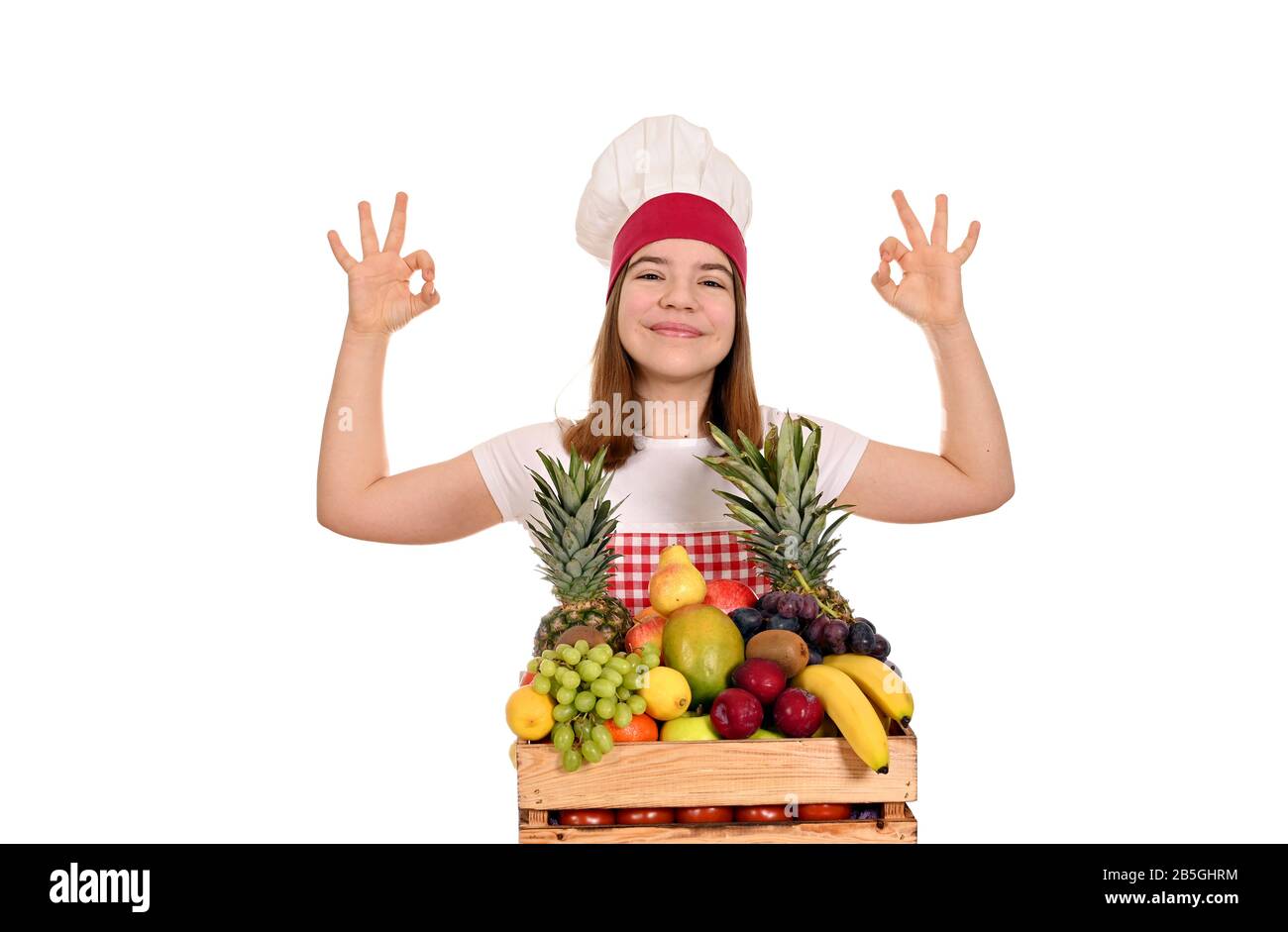 female cook with fruit and ok hand signs Stock Photo - Alamy