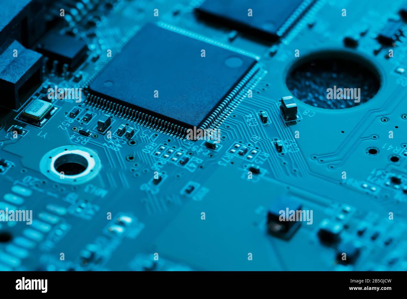 Electronic circuit board close up. Processor, chips and capacitors ...