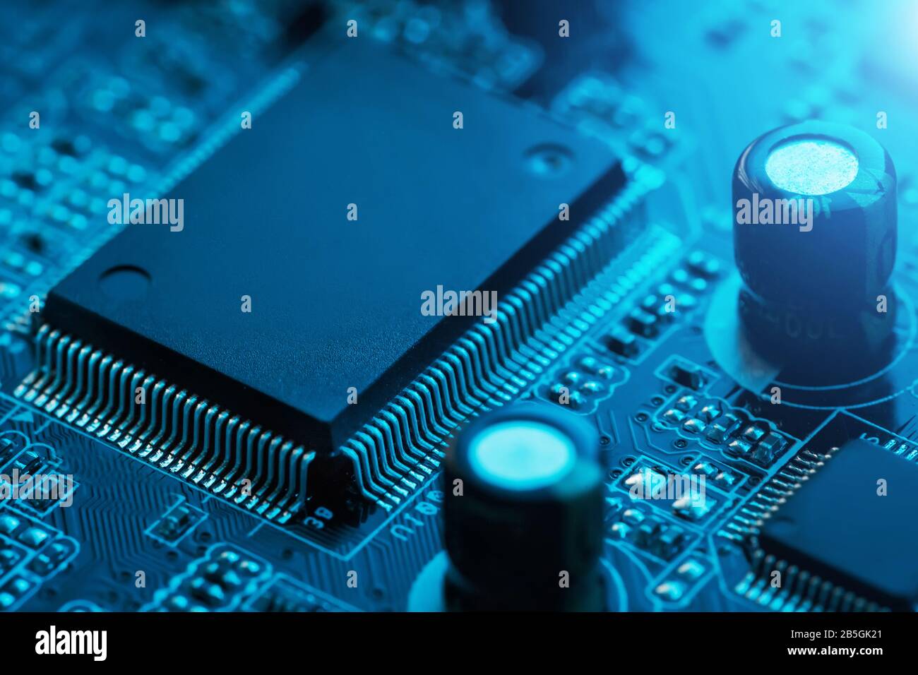 Electronic circuit board close up. Processor, chips and capacitors ...