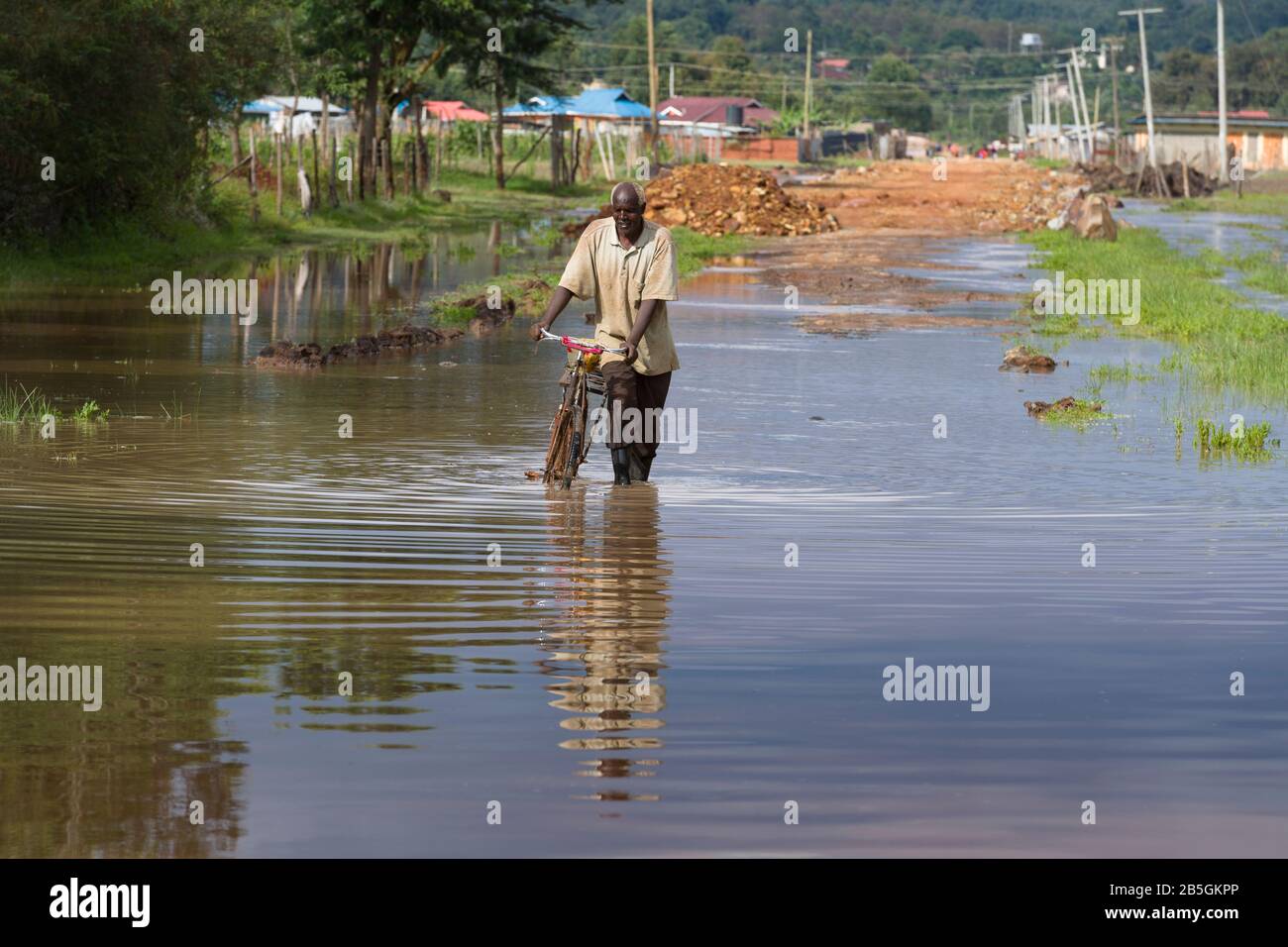 Wading through flood water africa hi-res stock photography and images ...