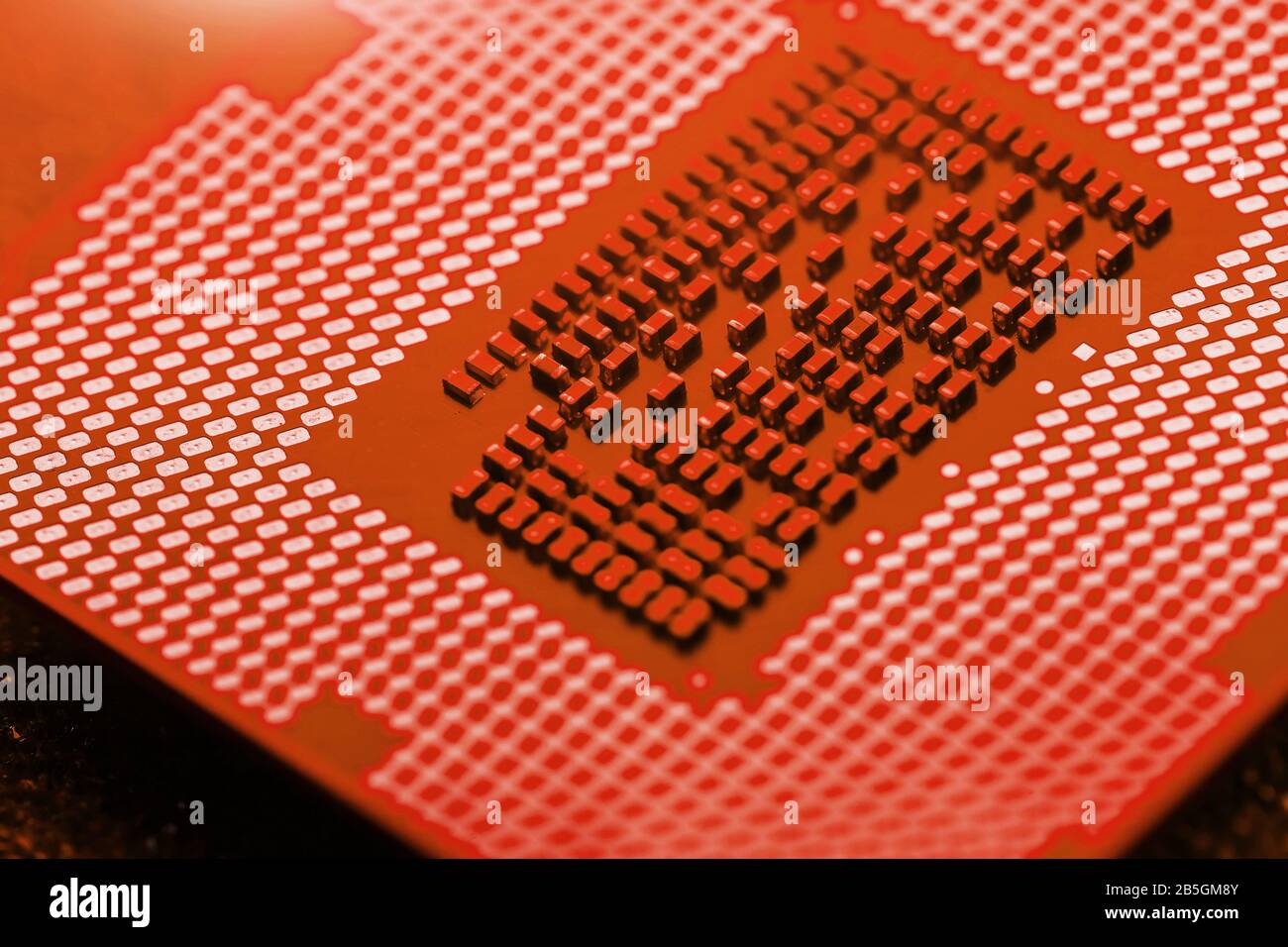 The central processor on the computer motherboard in red colors. PC ...