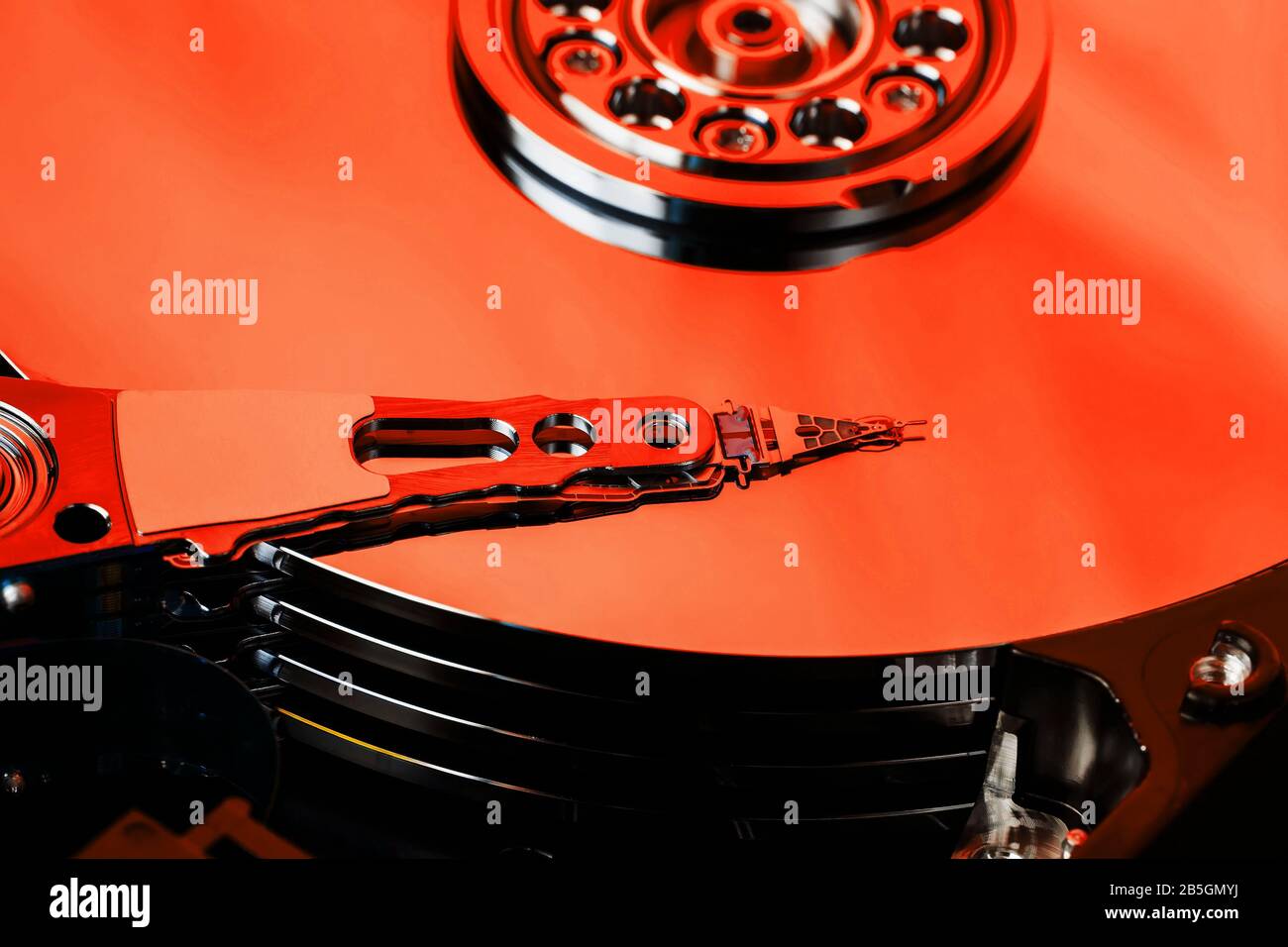 The hard disk from the computer HDD is red, with a mirror effect. The ...