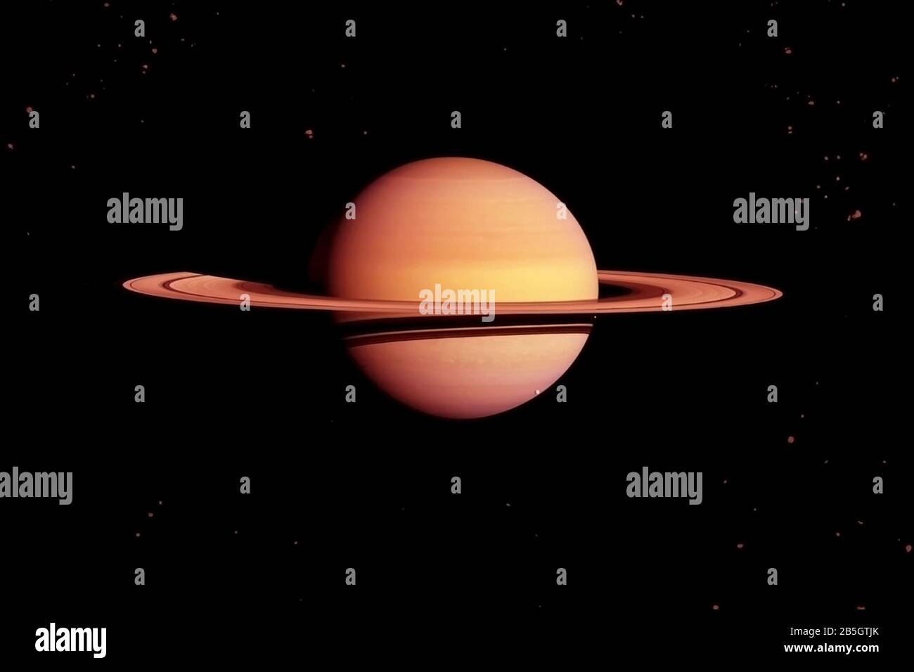 Saturn in unusual colors, on a dark background. Elements of this image ...