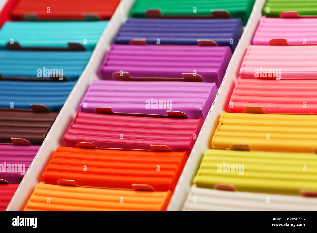 Plasticine in a box of multi-colored pieces in full screen, material ...