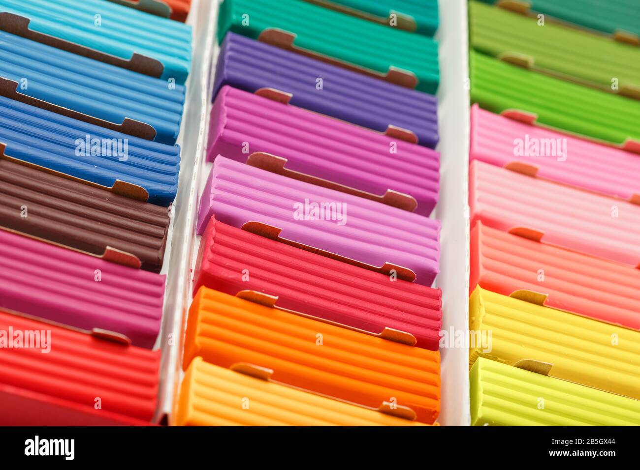 Plasticine in a box of multi-colored pieces in full screen, material ...