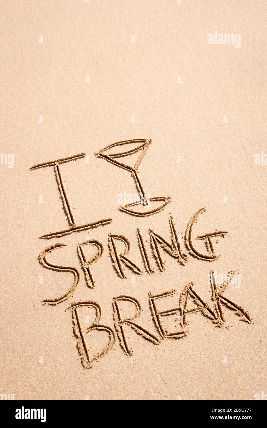 I Love Spring Break message handwritten on the beach with a cocktail ...