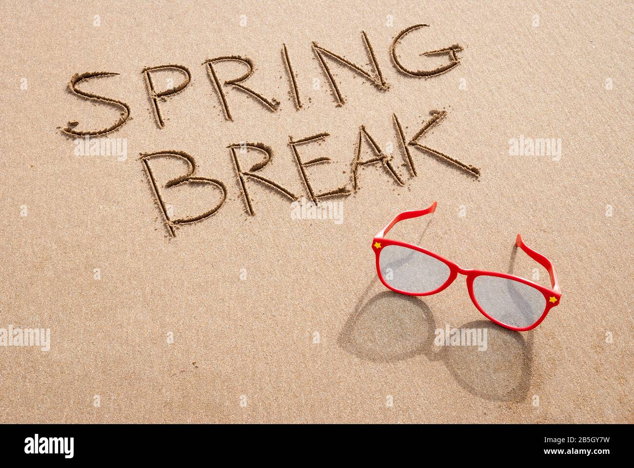 Simple Spring Break message handwritten in smooth sand with novelty ...
