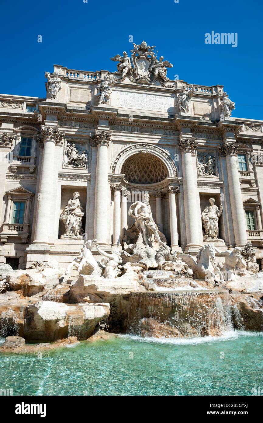 Bright sunny view of Trevi Fountain from the waters of the empty pool ...