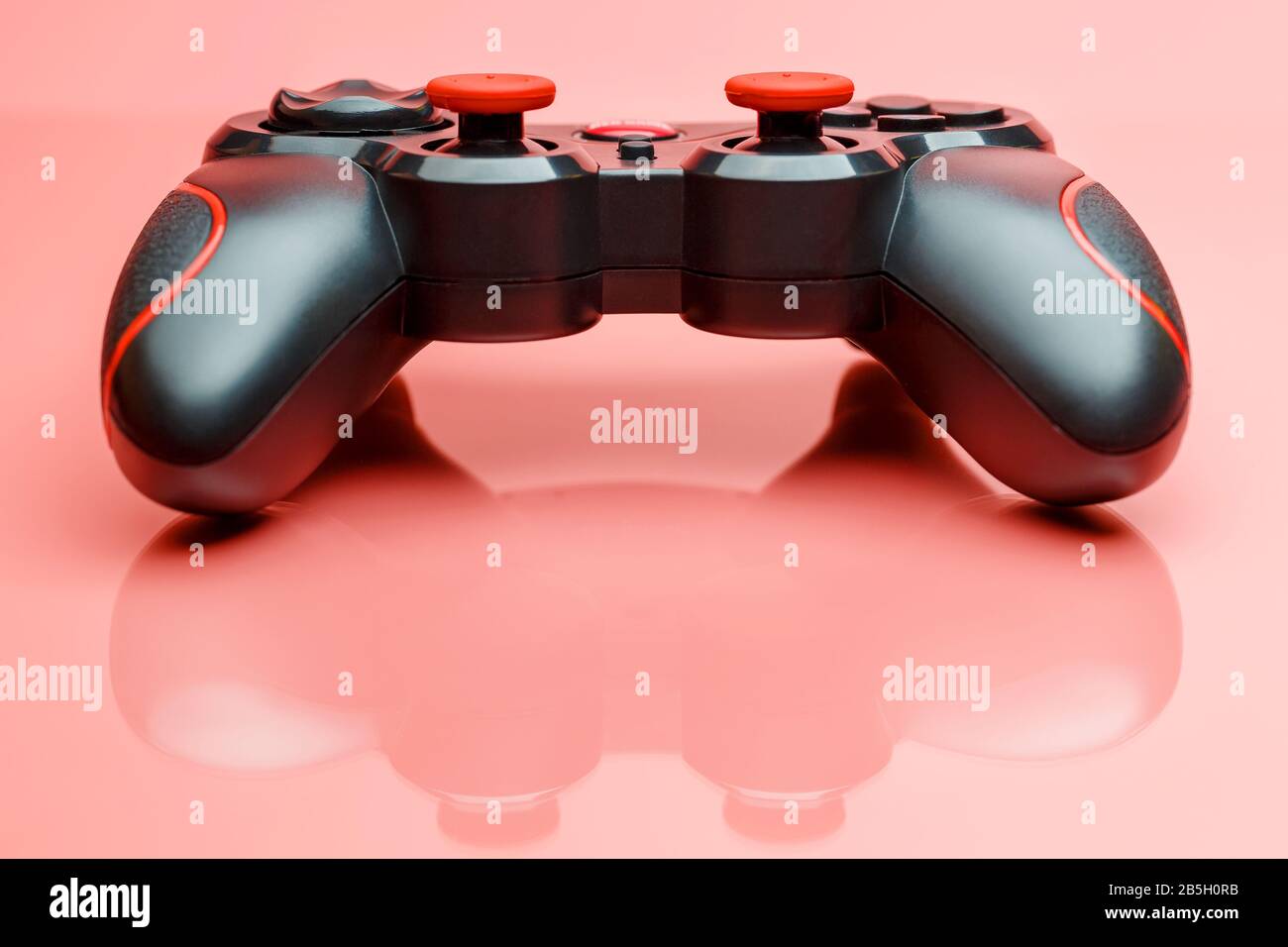 Game controller gamepad on pink background with . Device to control and ...