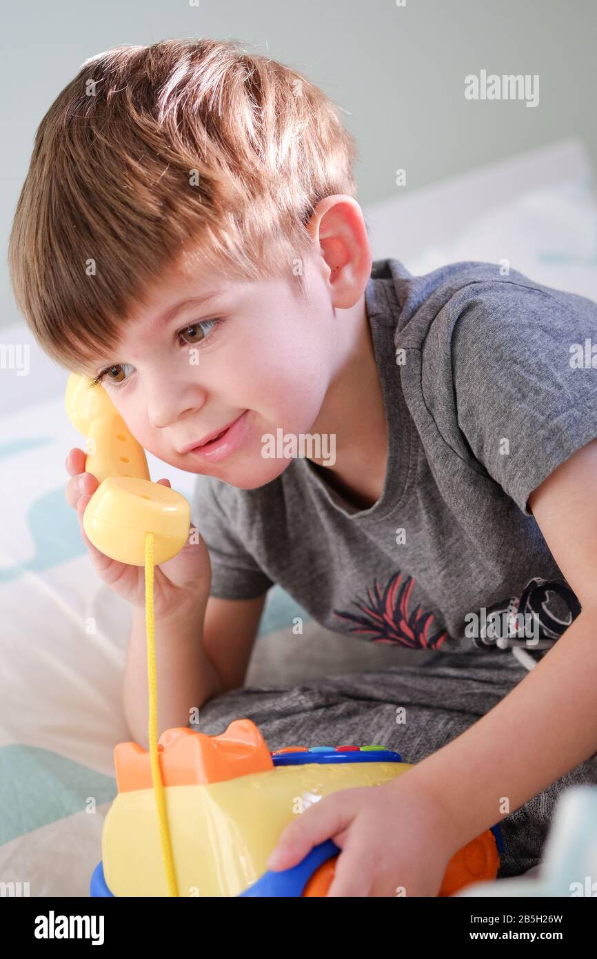 Boy child telephone home hi-res stock photography and images - Alamy