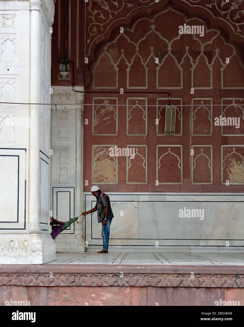 Delhi, India - 7th November 2019:Cleaner swinging the cleaning cloth at ...