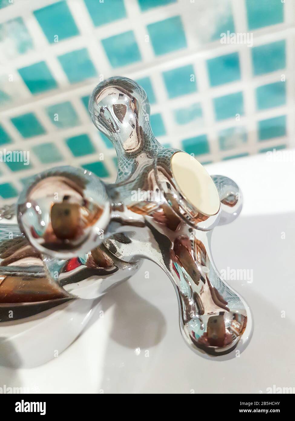 detail of the bright keys of a sink faucet Stock Photo - Alamy