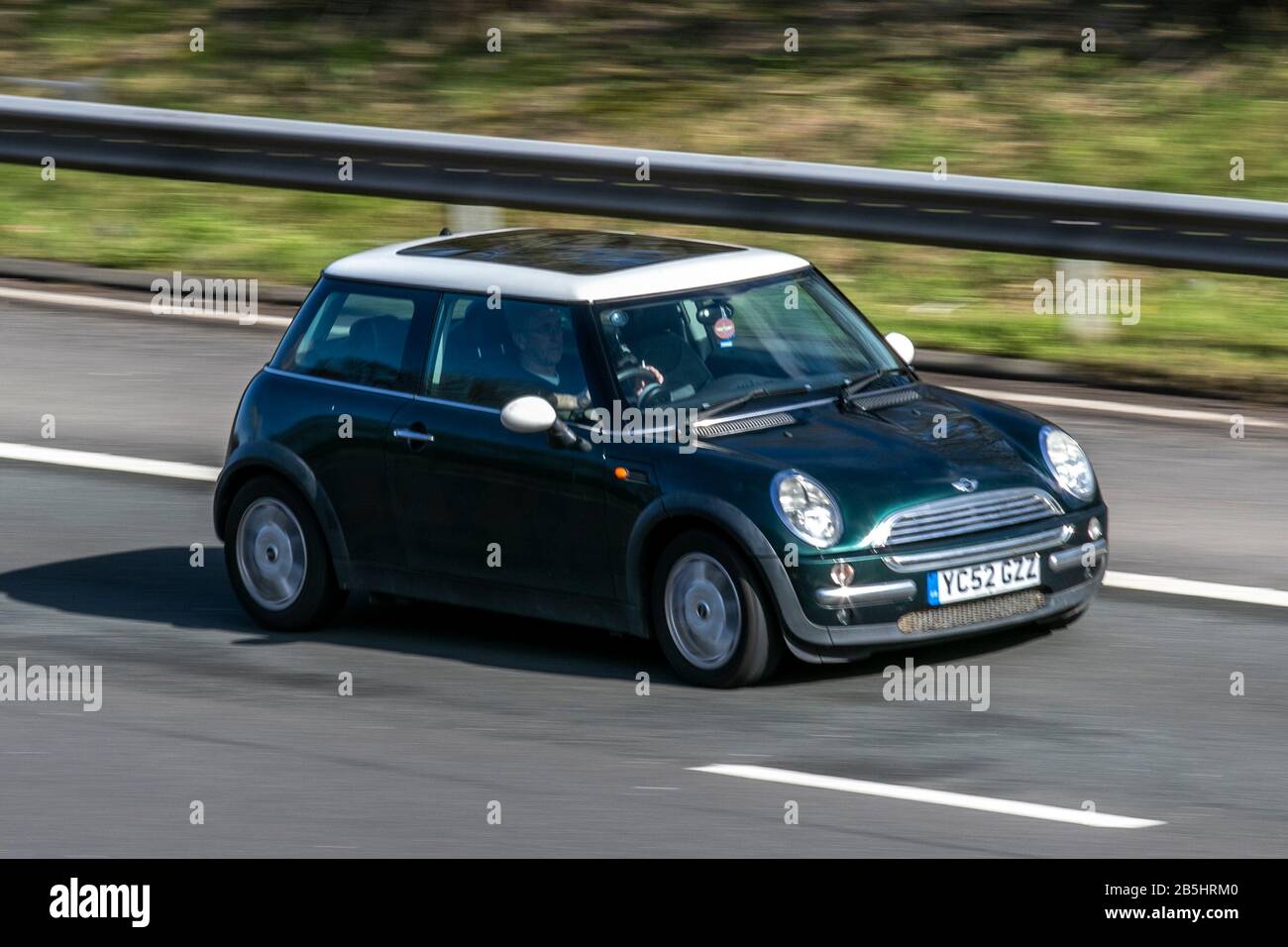 2003 green Mini Cooper; UK vehicular traffic, transport, modern ...