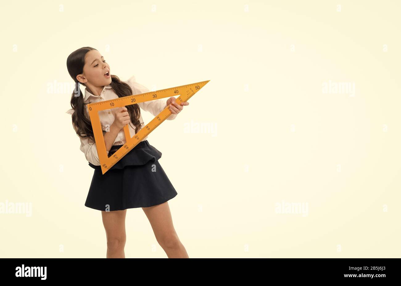 Education. Small child with measuring instrument at school lesson ...