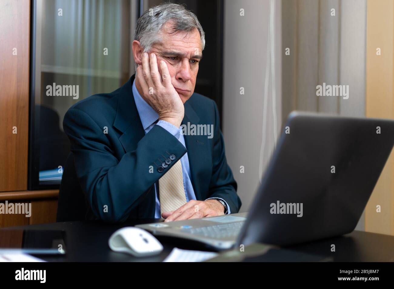 Confused businessman in front of computer hi-res stock photography and ...