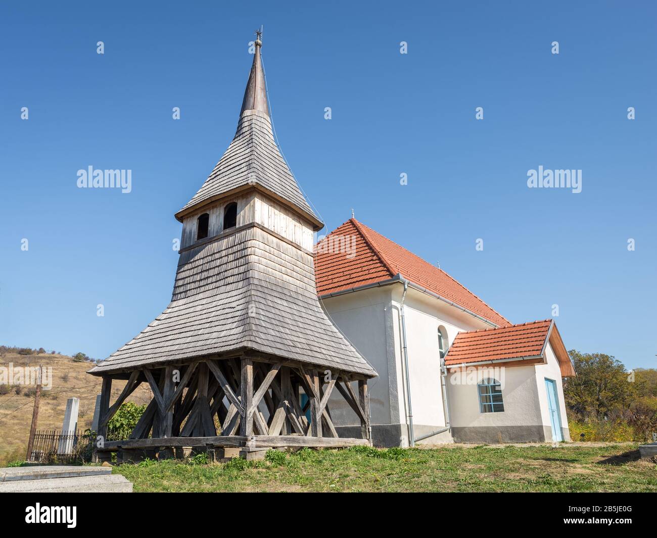 Wooden bell tower of a church outside a village in Transylvania ...
