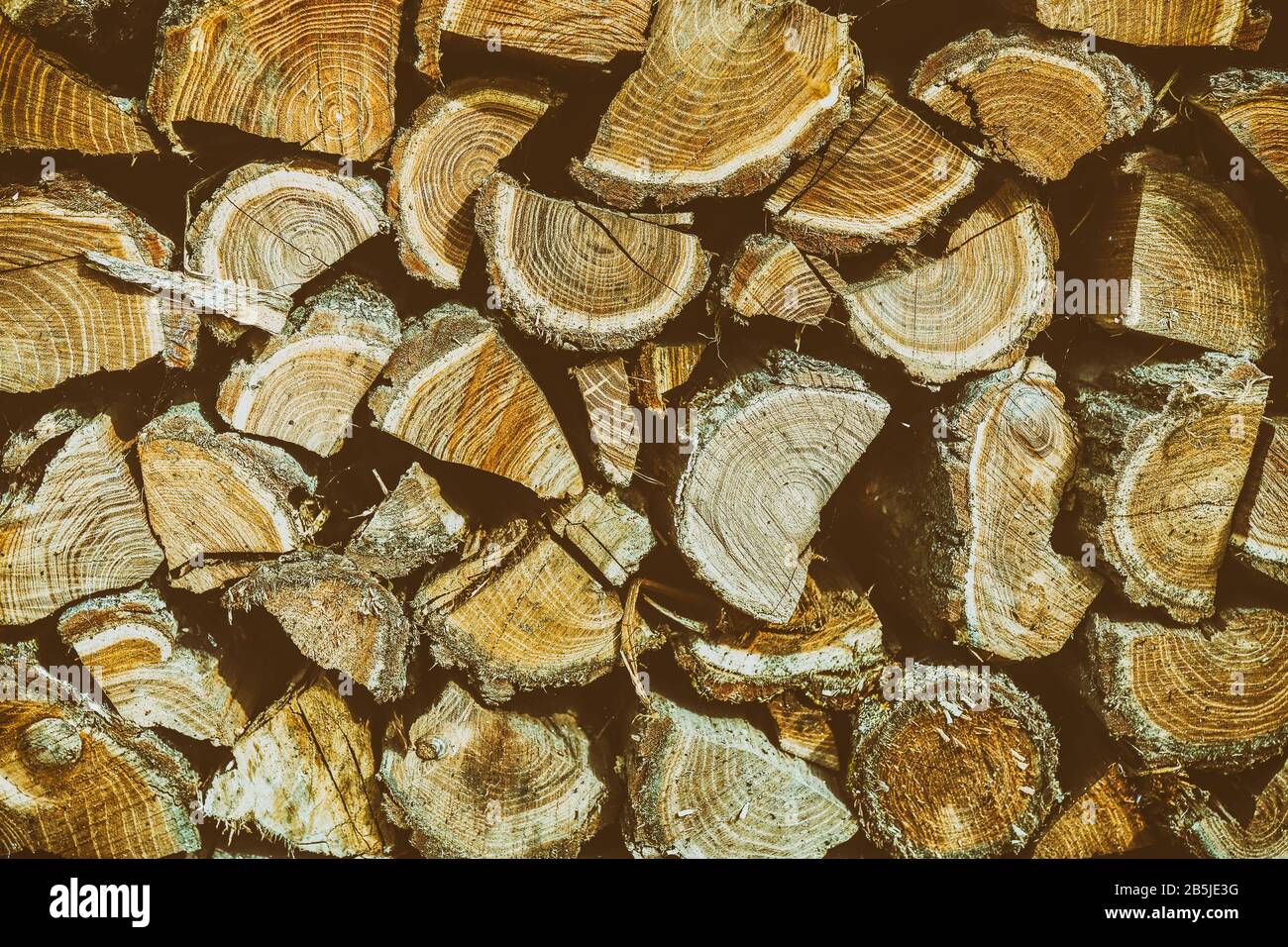 Background of firewood. The texture of chopped firewood on a dark ...
