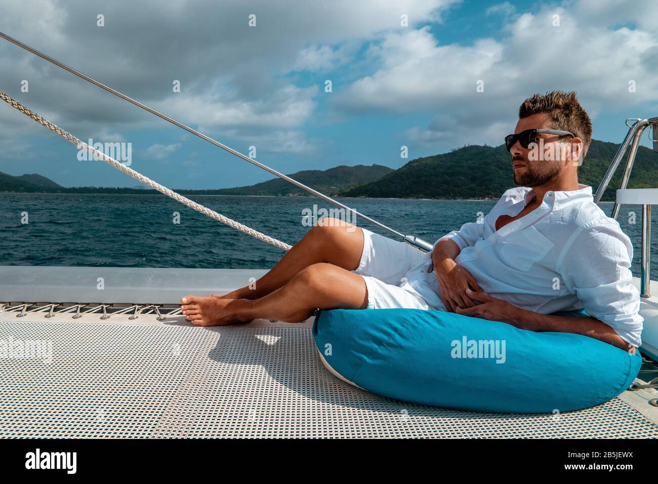 Handsome men on sailing boat hi-res stock photography and images - Alamy