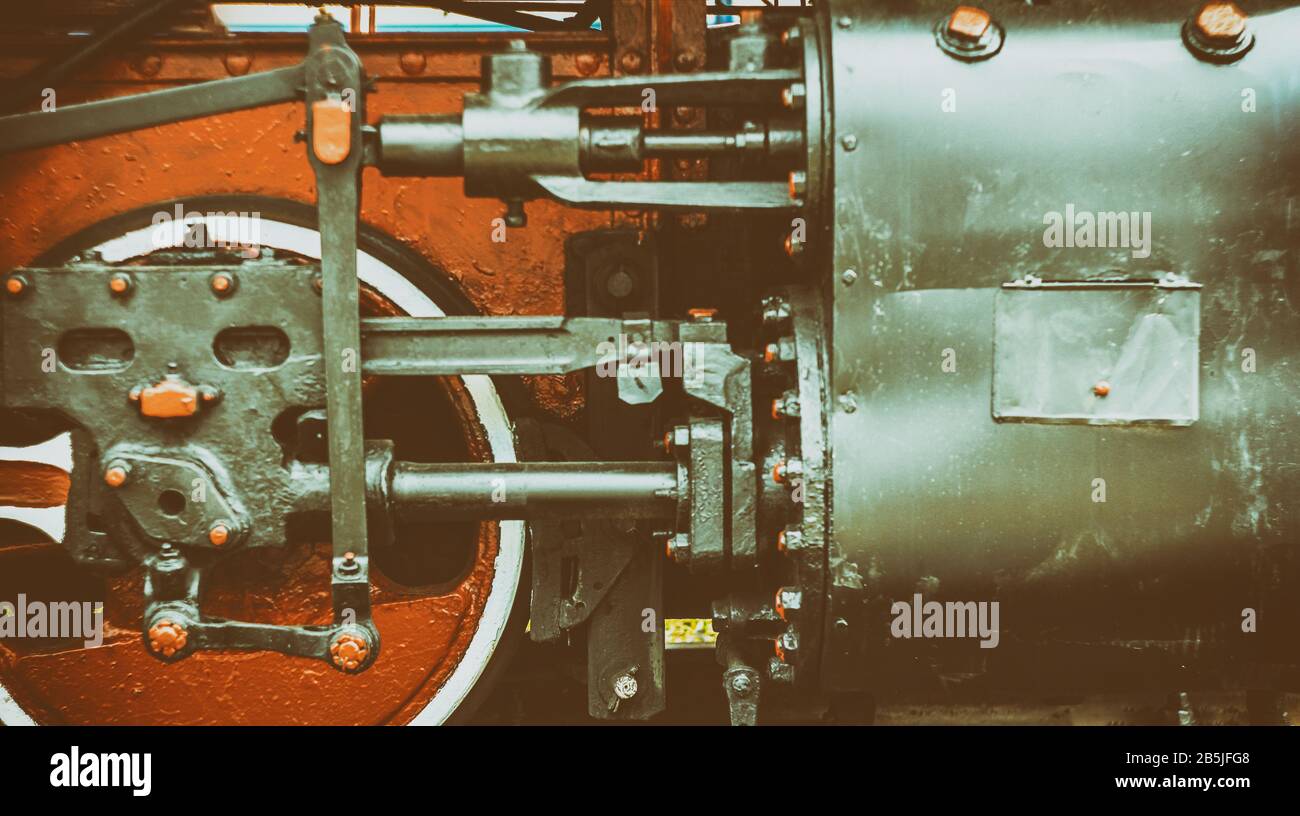 Pistons and driving wheel of the historic steam locomotive.Grunge steam ...