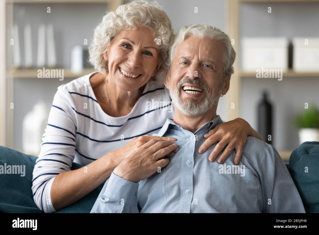 Portrait of happy elderly couple relax at home Stock Photo - Alamy
