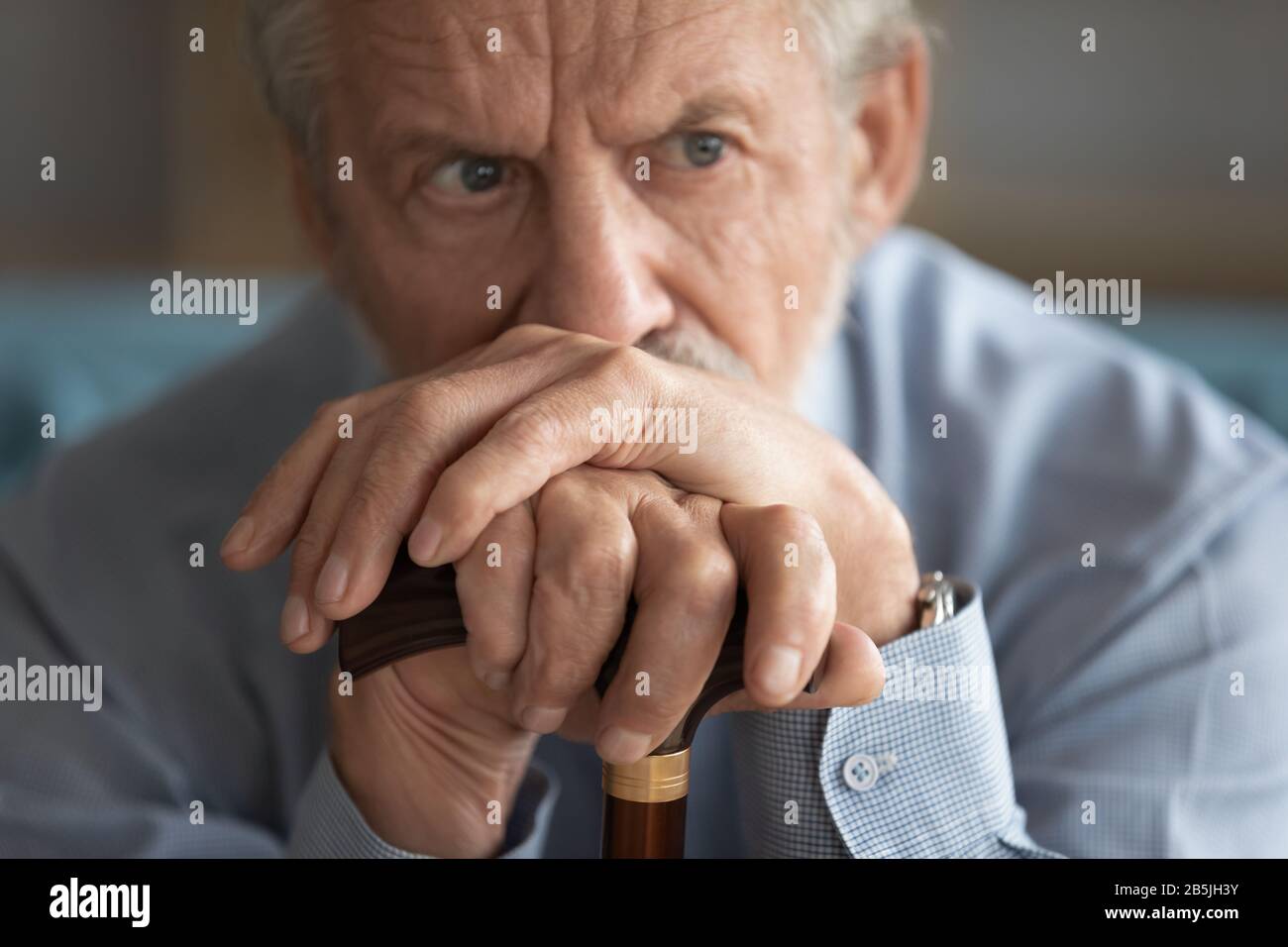 Sad disabled old man lot in thoughts at home Stock Photo - Alamy