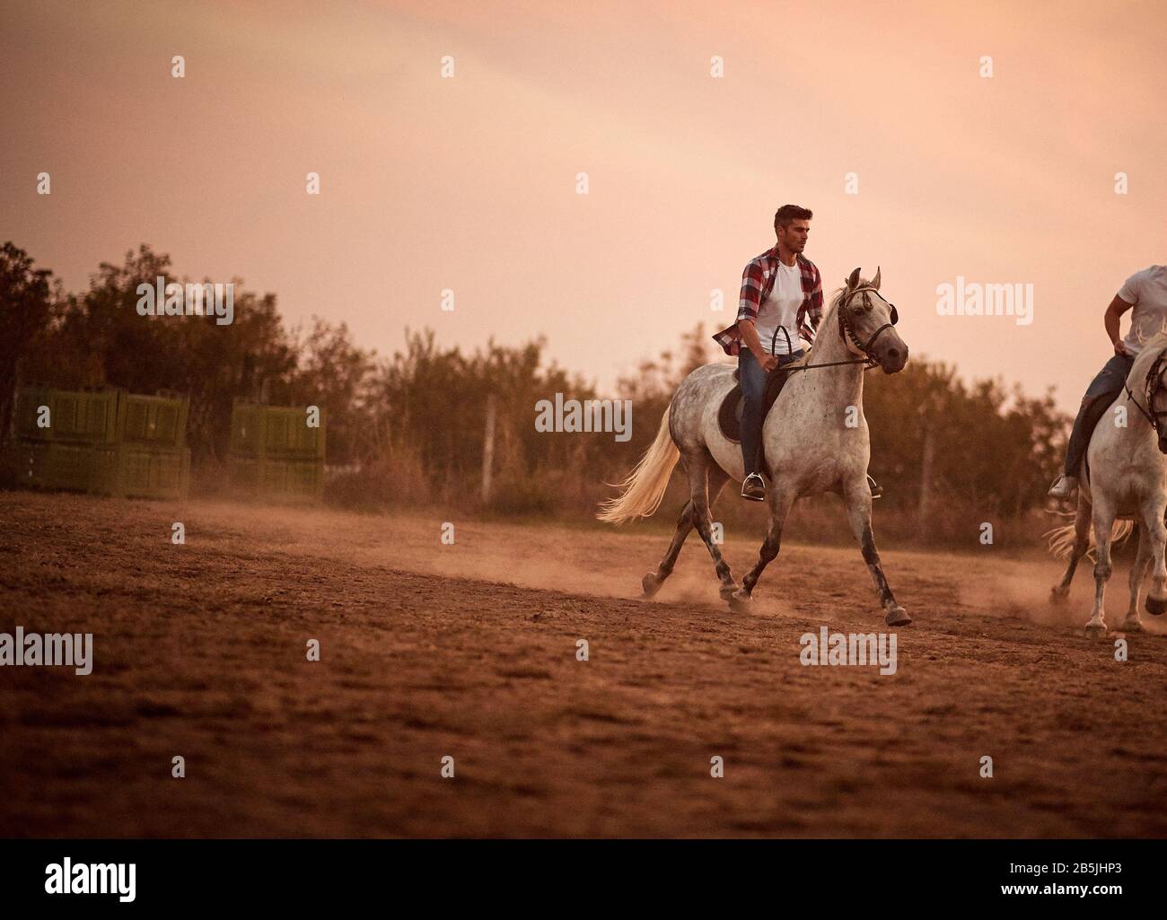Two men on galloping hi-res stock photography and images - Alamy