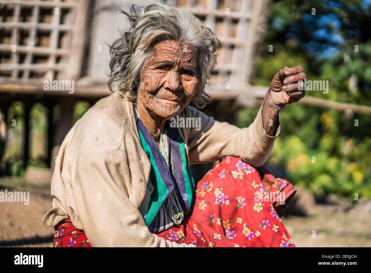 Local woman with tattooed face from village Mindat, Chin state, Myanmar ...