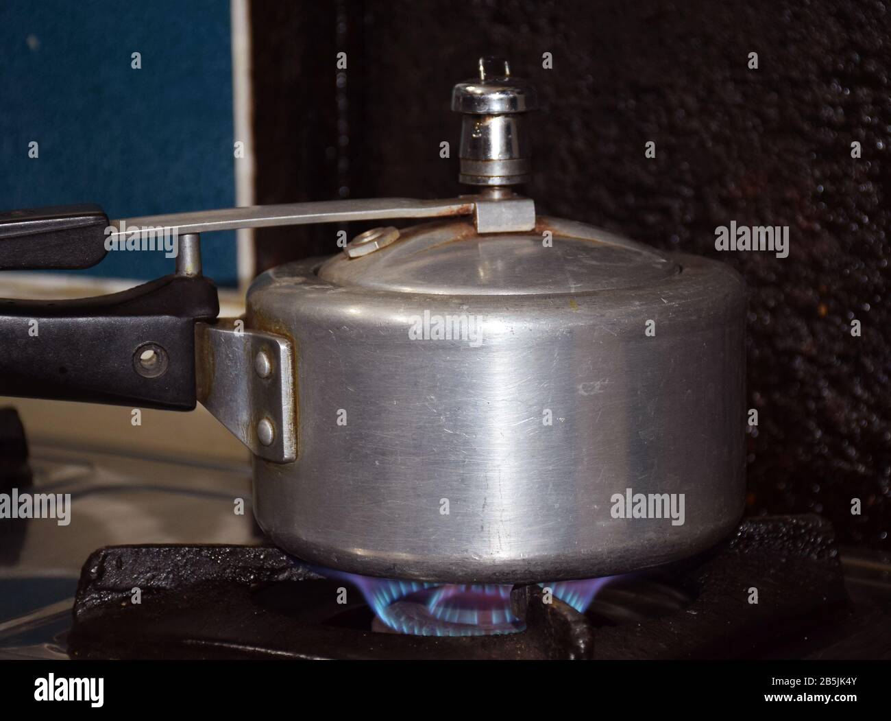 A pressure cooker over a gas Stock Photo - Alamy