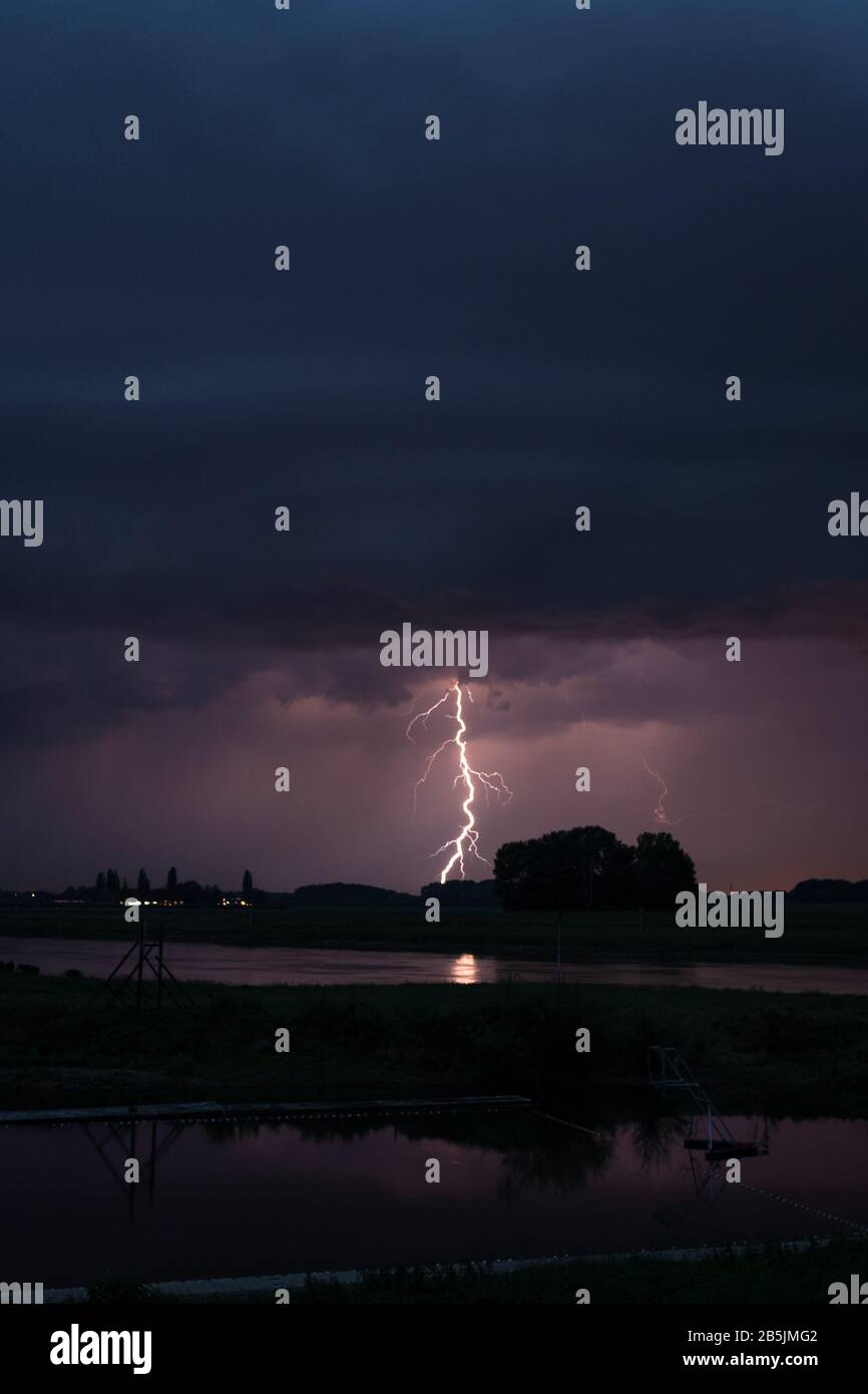 Stunning landscape image of a lightning bolt hitting the ground close ...