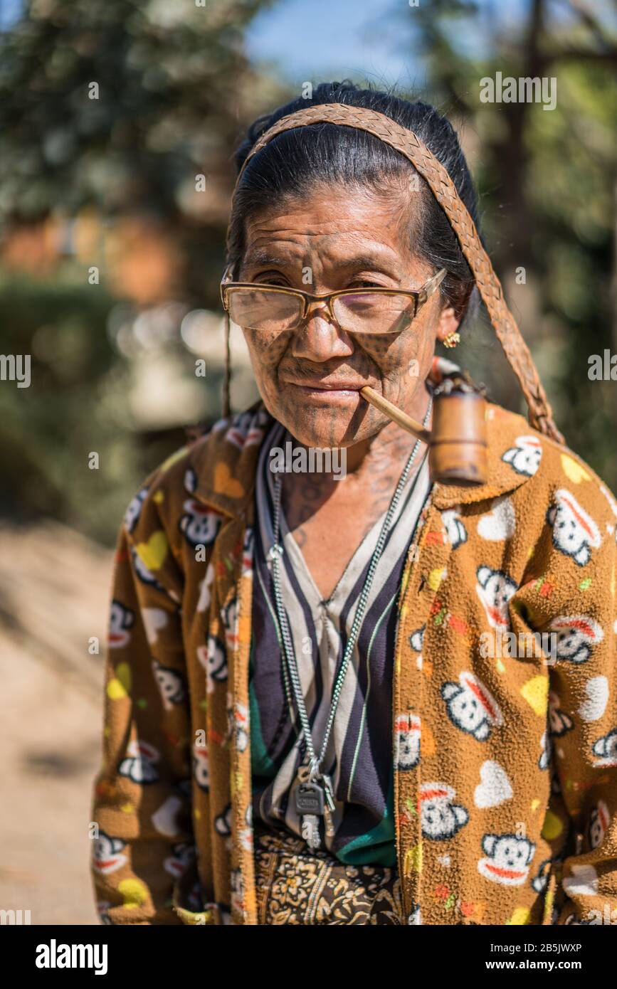 Local woman with tattooed face from village Mindat, Chin state, Myanmar ...