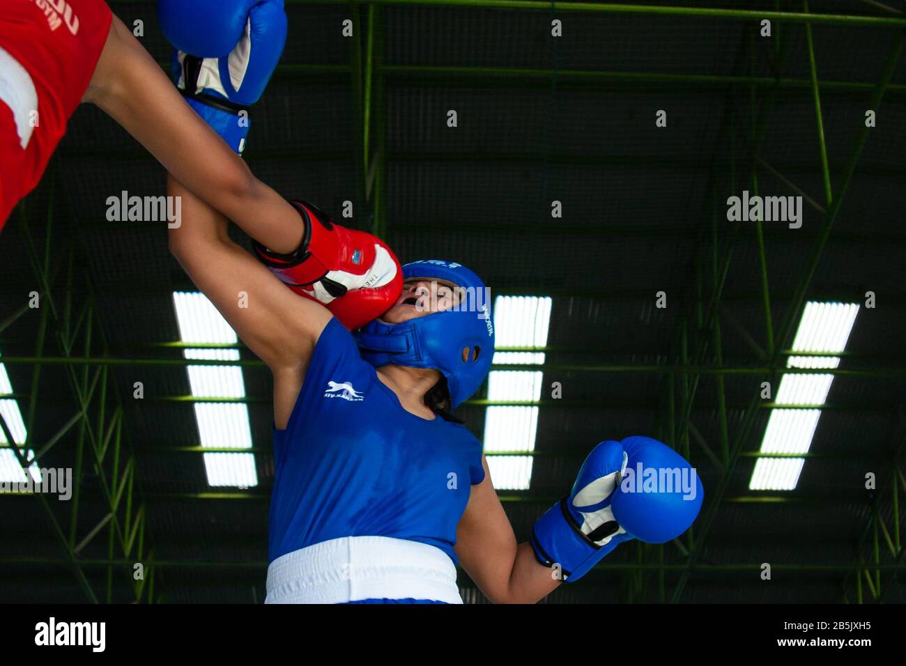 Nepalese woman boxer in blue jersey, Roshani Rai in action during a ...