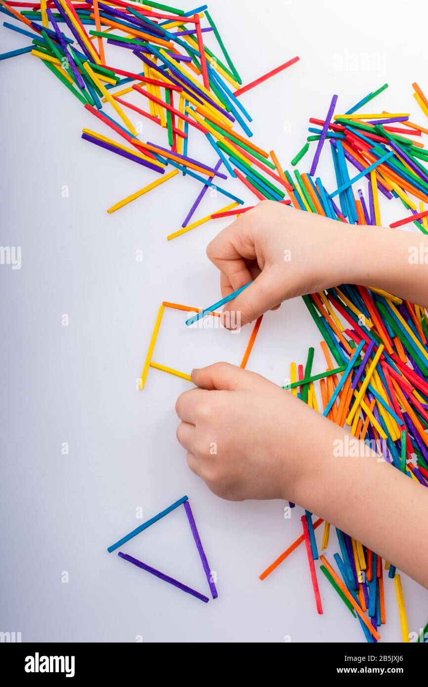 Kid making rectangular and triangle shape as creative concept Stock ...