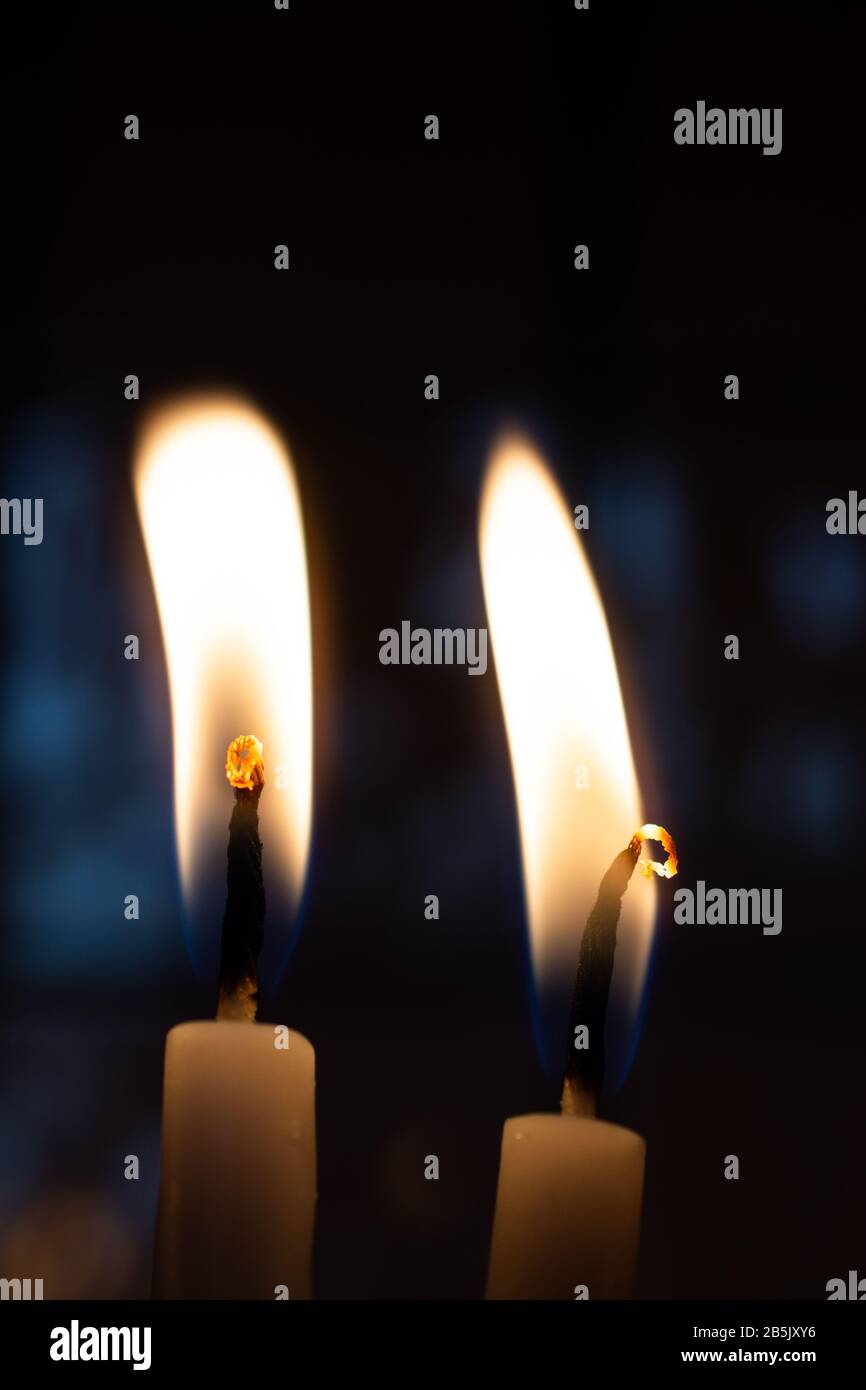 burning candle making light in view Stock Photo - Alamy