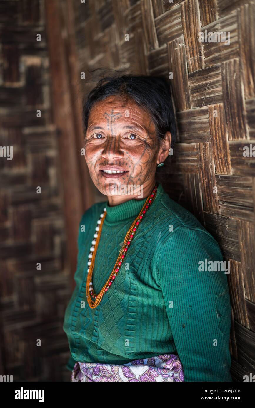 Local woman with tattooed face from village Mindat, Chin state, Myanmar ...