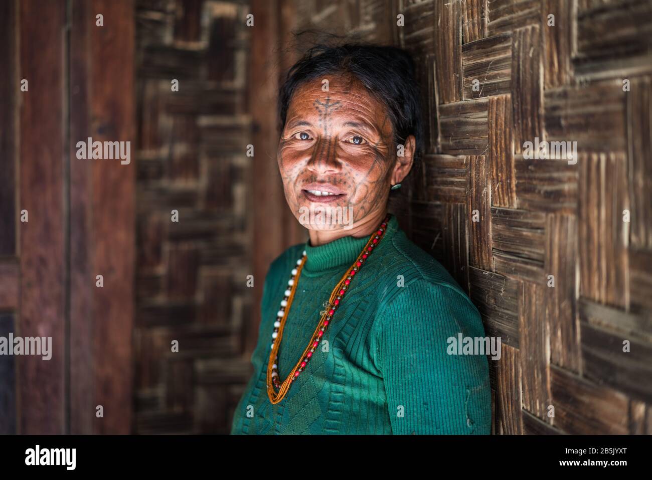 Local woman with tattooed face from village Mindat, Chin state, Myanmar ...