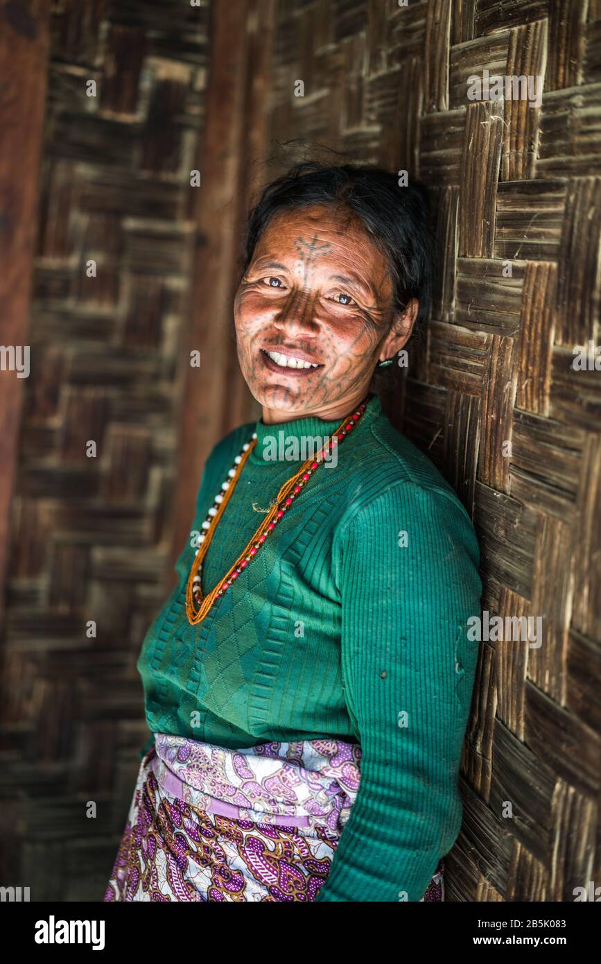 Local woman with tattooed face from village Mindat, Chin state, Myanmar ...