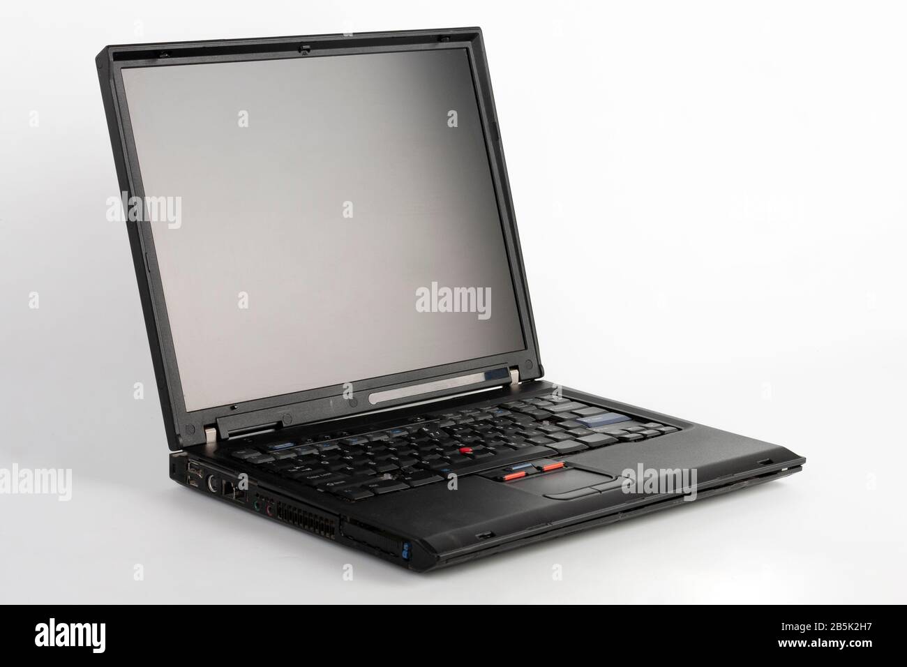 Old laptop on white background, which was produced in 2005, outer cover ...