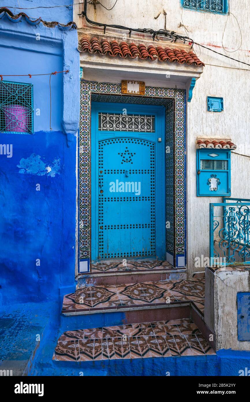 Colorful wooden doors at famous blue city of Chefchaouen, Morocco Stock ...