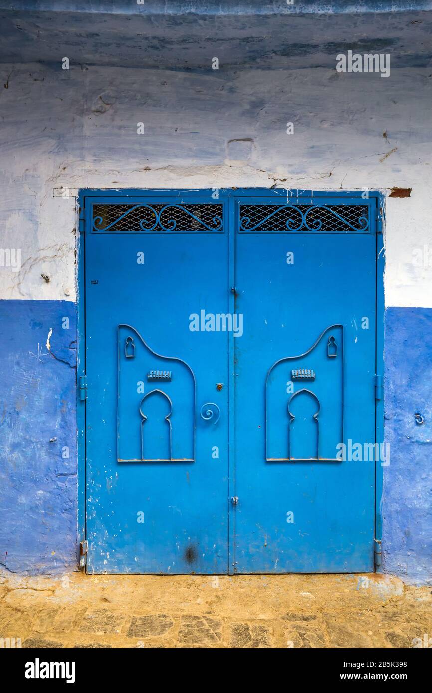 Colorful wooden doors at famous blue city of Chefchaouen, Morocco Stock ...