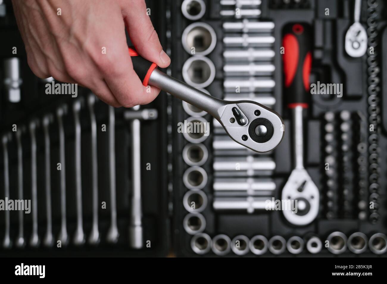 human hand with car repair tool on tool box kit background Stock Photo ...