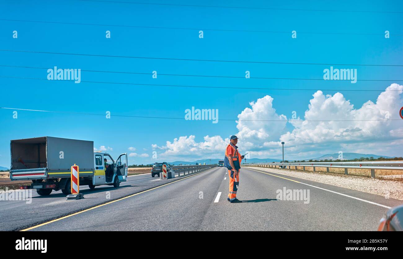 employee of road services on the highway Stock Photo - Alamy