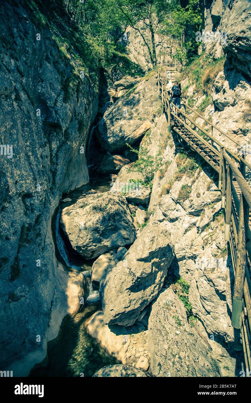 Austria, Styriatourist attraction styria waterfalls three people walk ...