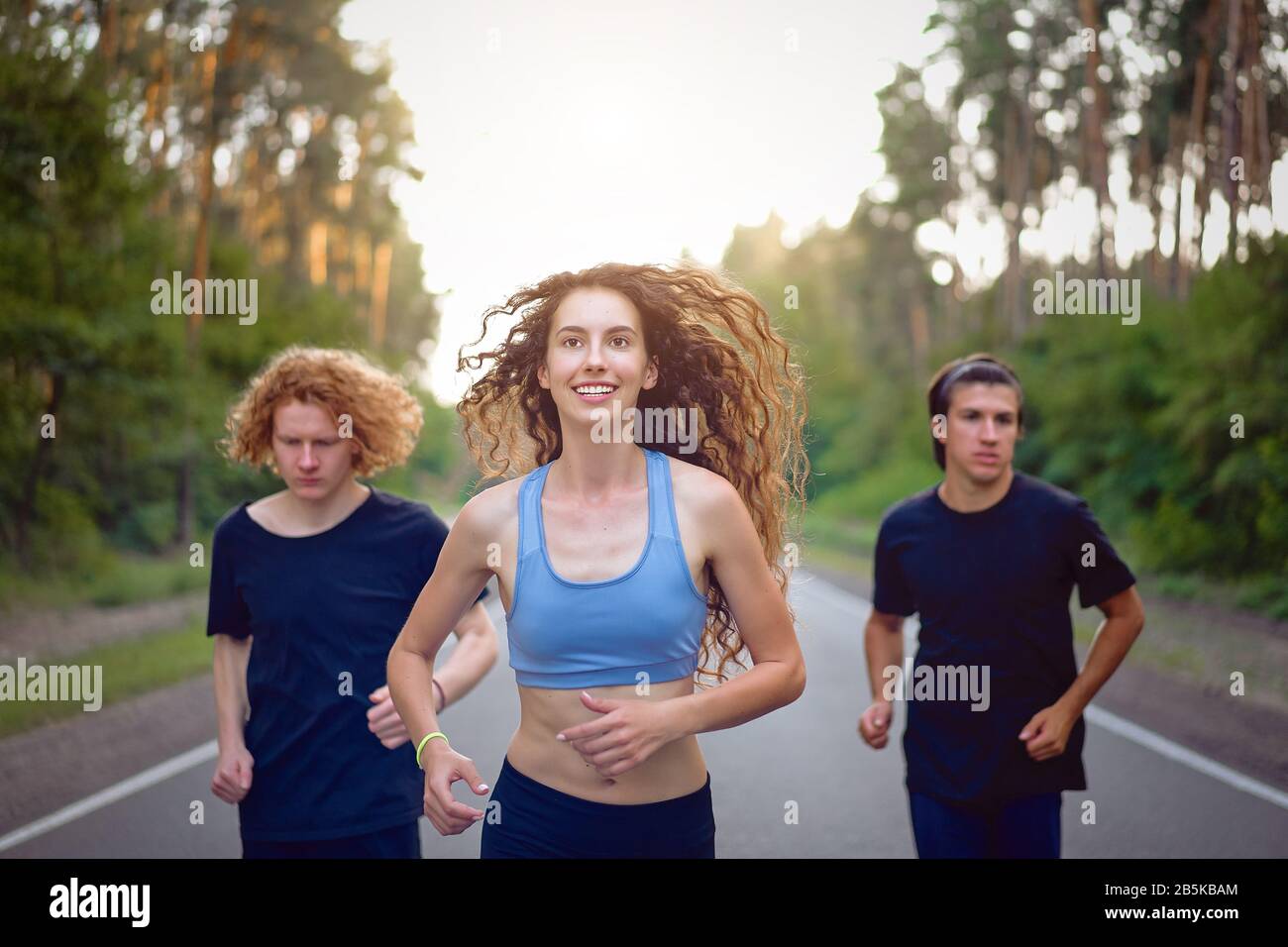 Three Men Running In Marathon Stock Photos & Three Men Running In ...