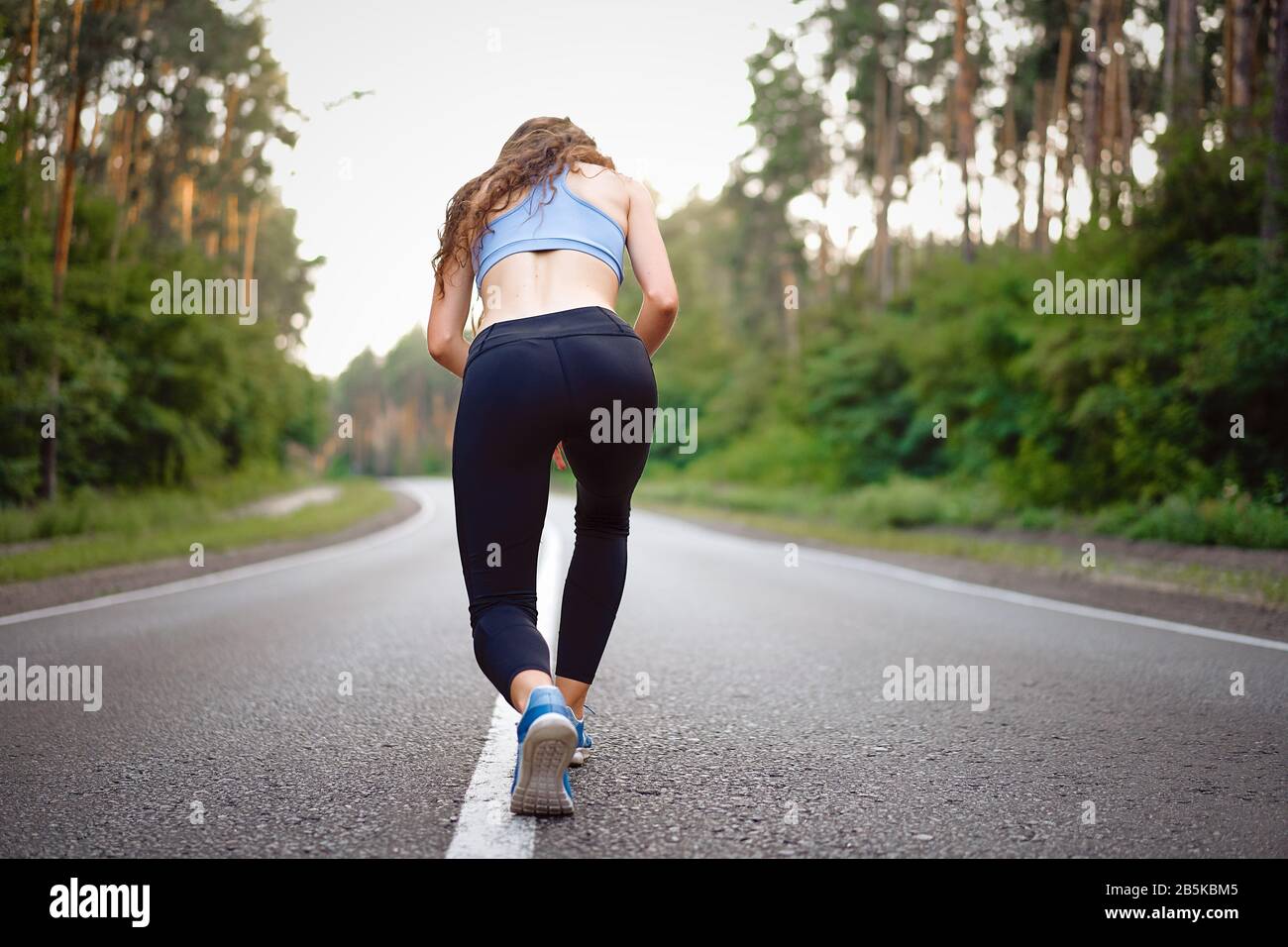 Young girl running from behind hi-res stock photography and images - Alamy