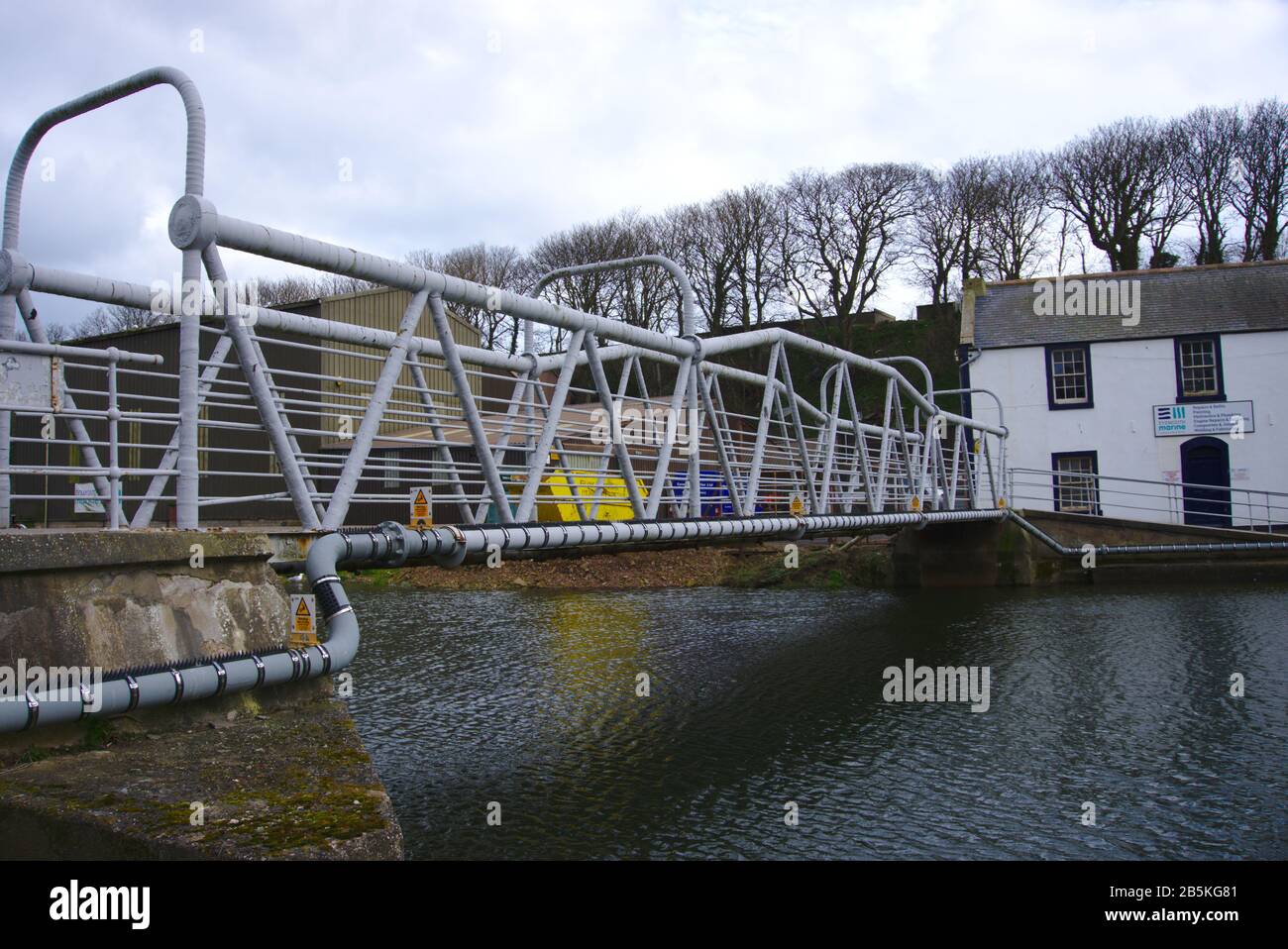 Bridge with pipe across the Eye Water at Eyemouth Harbour, Scottish ...