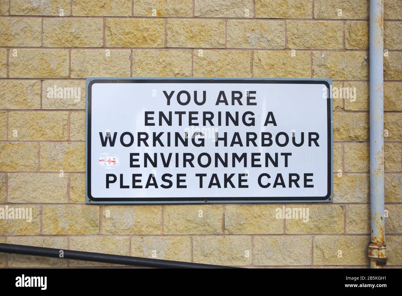 Working harbour environment warning sign, UK Stock Photo - Alamy