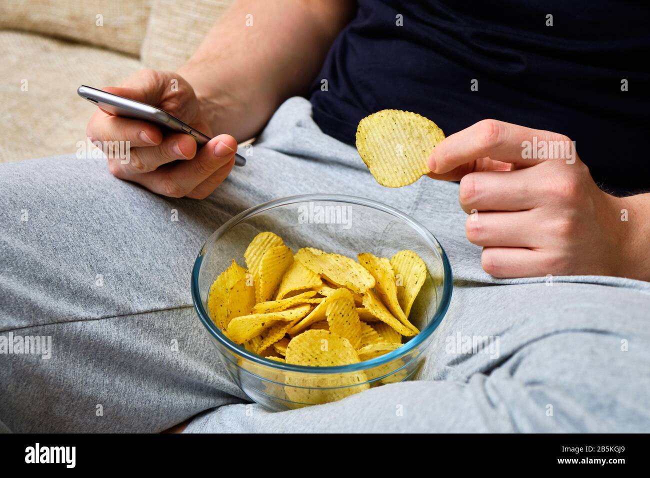 Fat man on couch hi-res stock photography and images - Alamy