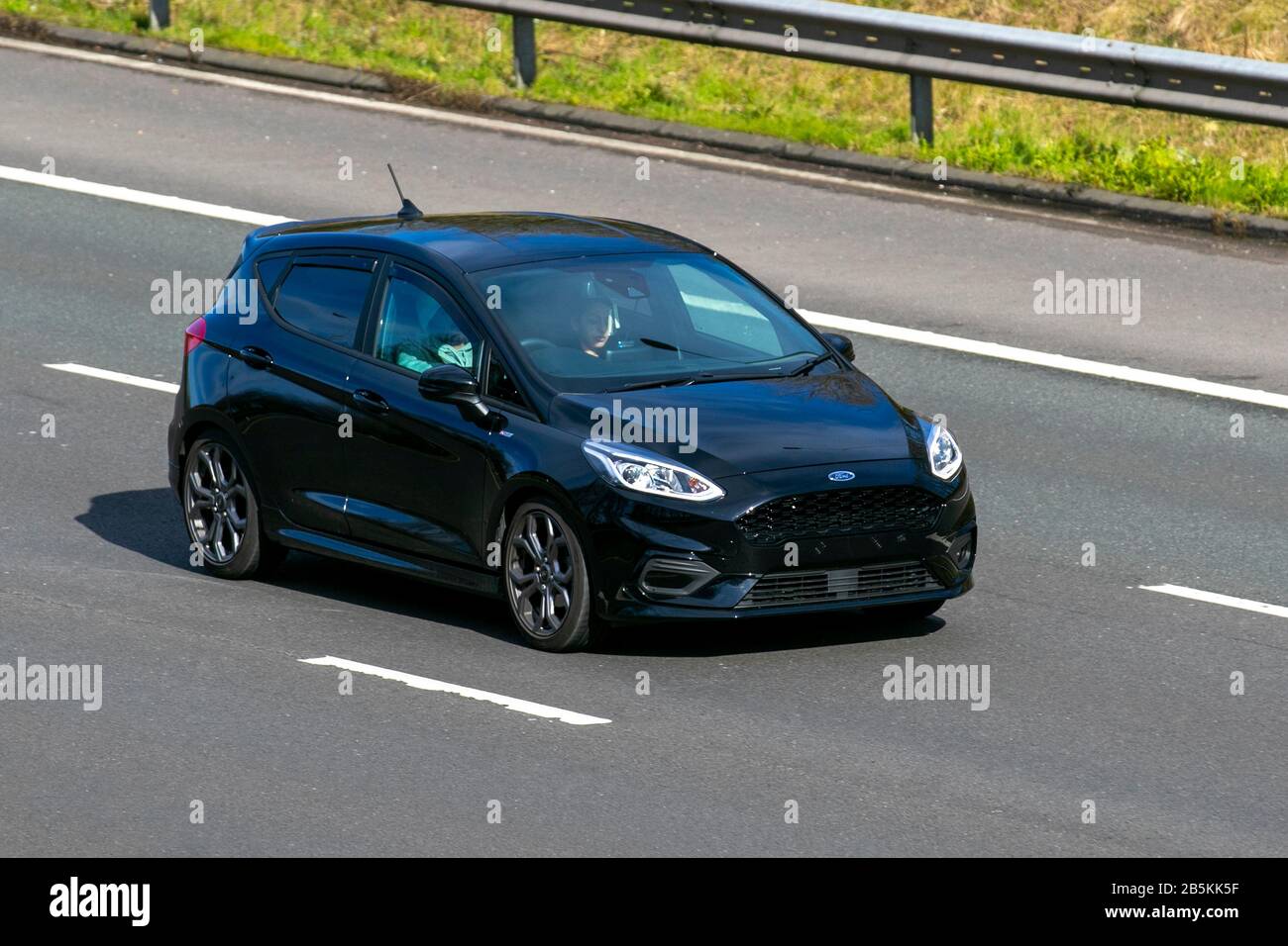 Black Ford Focus with no number plate; UK vehicular traffic, transport ...