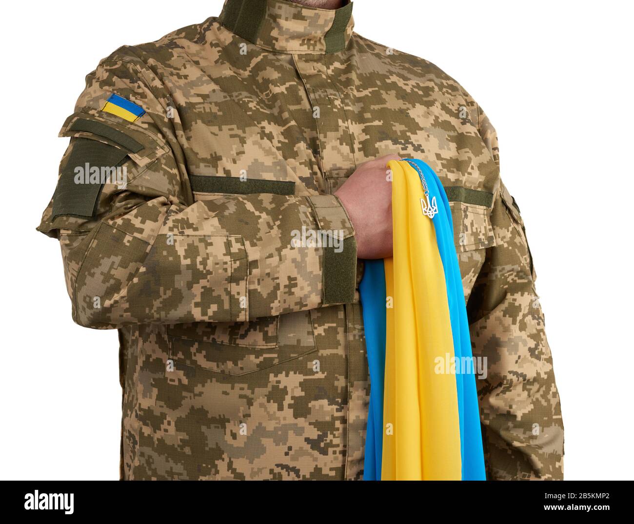Ukrainian man warrior dressed in a military pixel uniform holds the ...